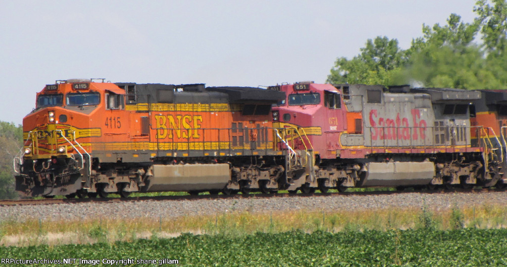BNSF 4115 heads a wb stack train.